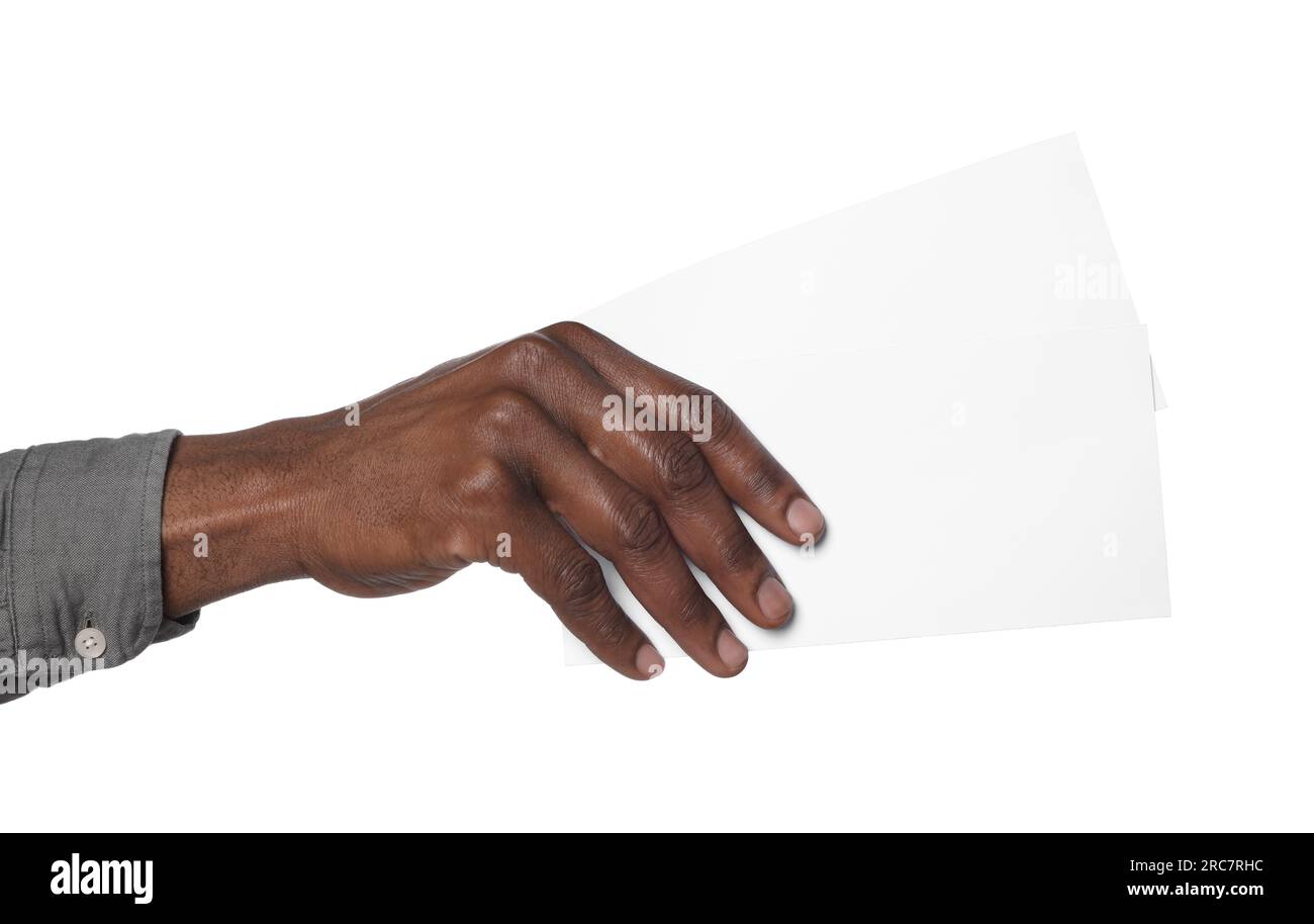 African American man holding flyers on white background, closeup ...