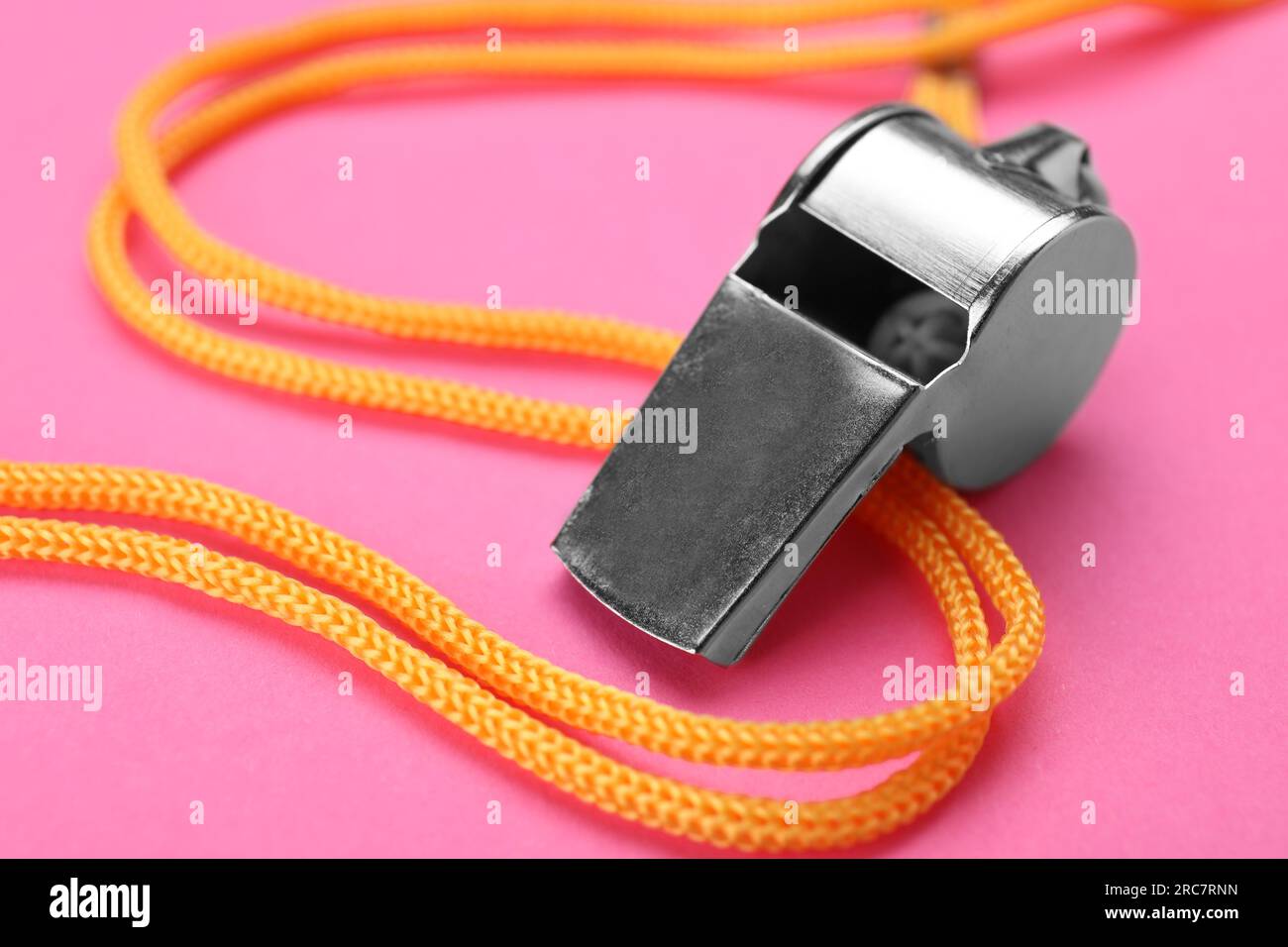 One metal whistle with cord on pink background, closeup Stock Photo - Alamy