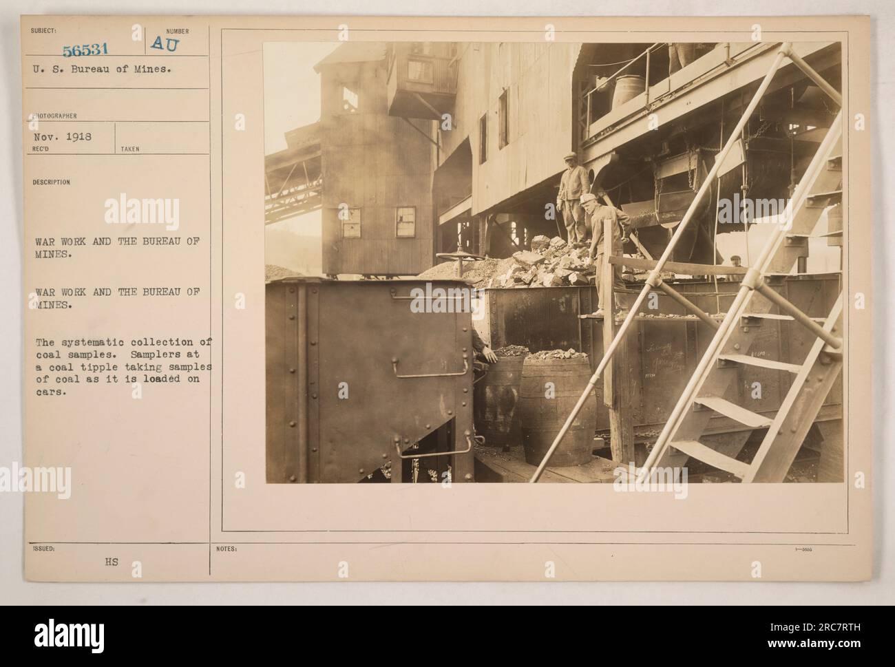 Coal samplers at a tipple collecting samples of coal being loaded onto ...