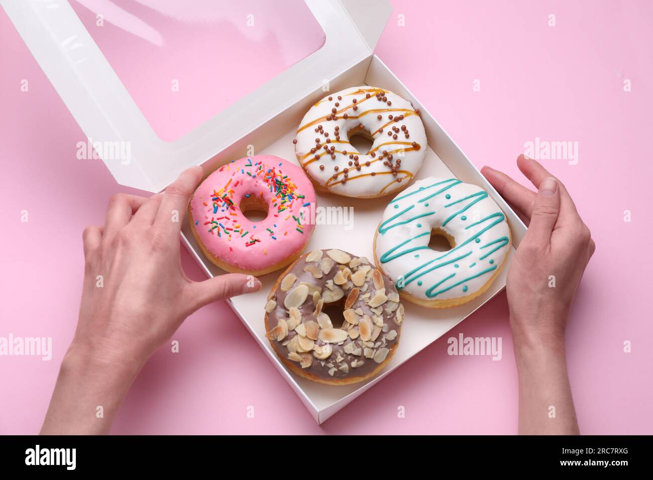 Woman taking delicious almonds hi-res stock photography and images - Alamy