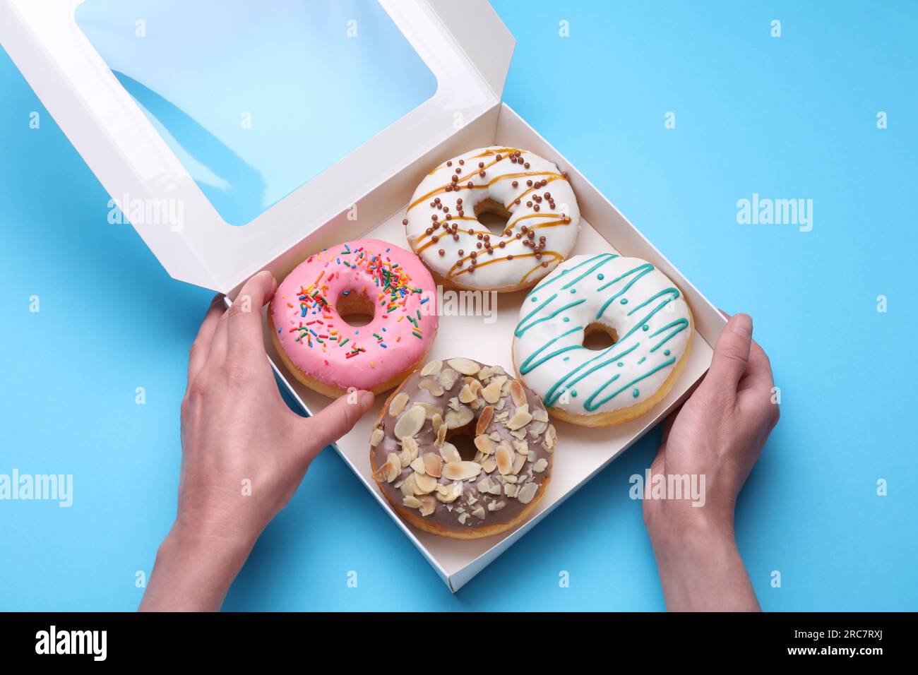 Woman taking delicious almonds hi-res stock photography and images - Alamy
