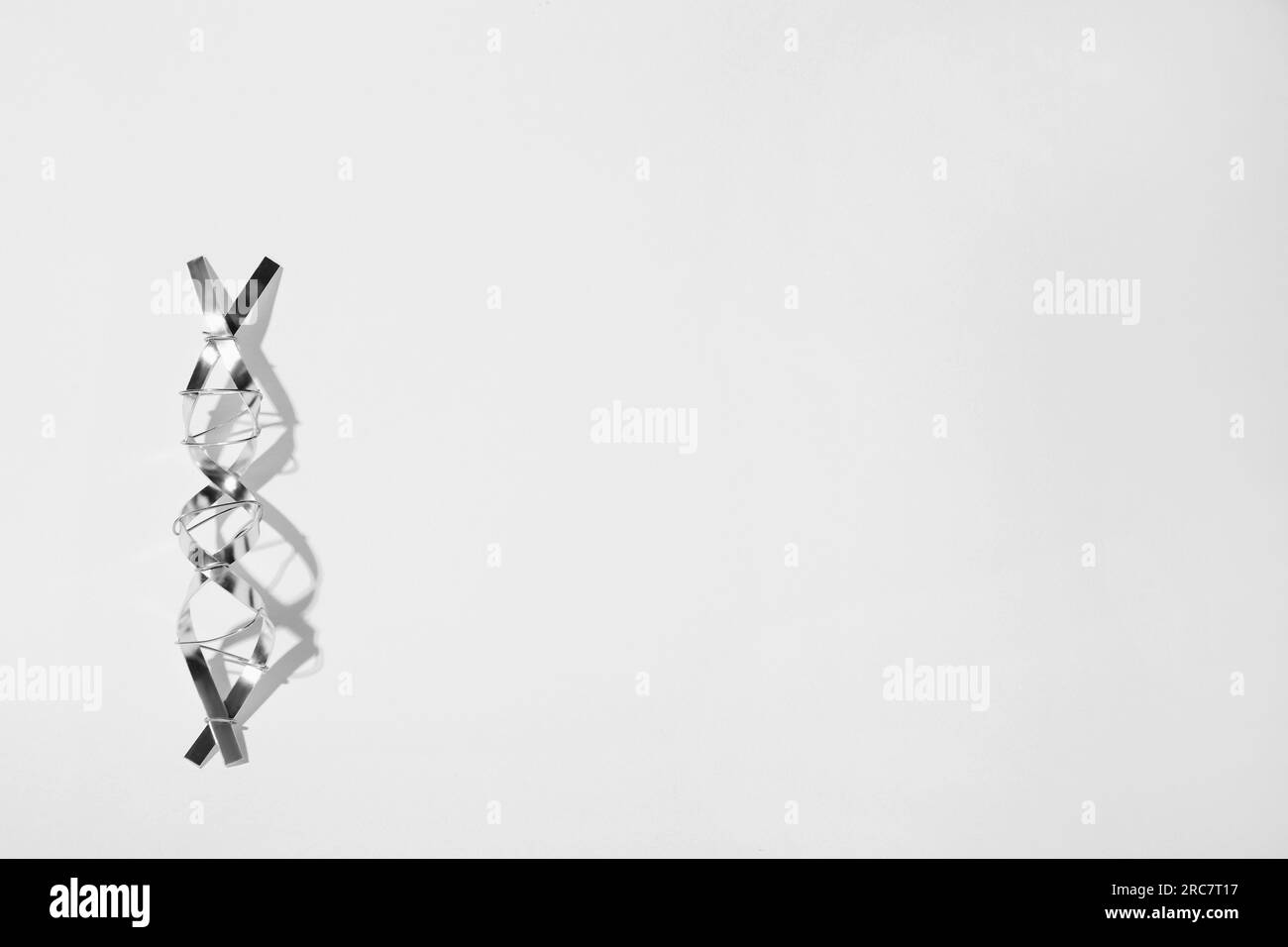 DNA molecular chain model made of metal on white background, top view ...