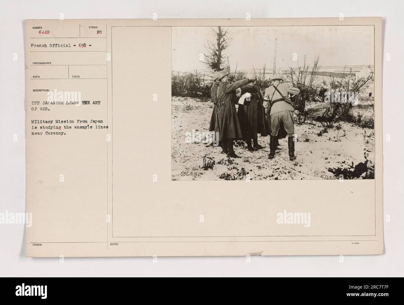 Japanese military mission studying enemy lines near Carenoy. The photo ...