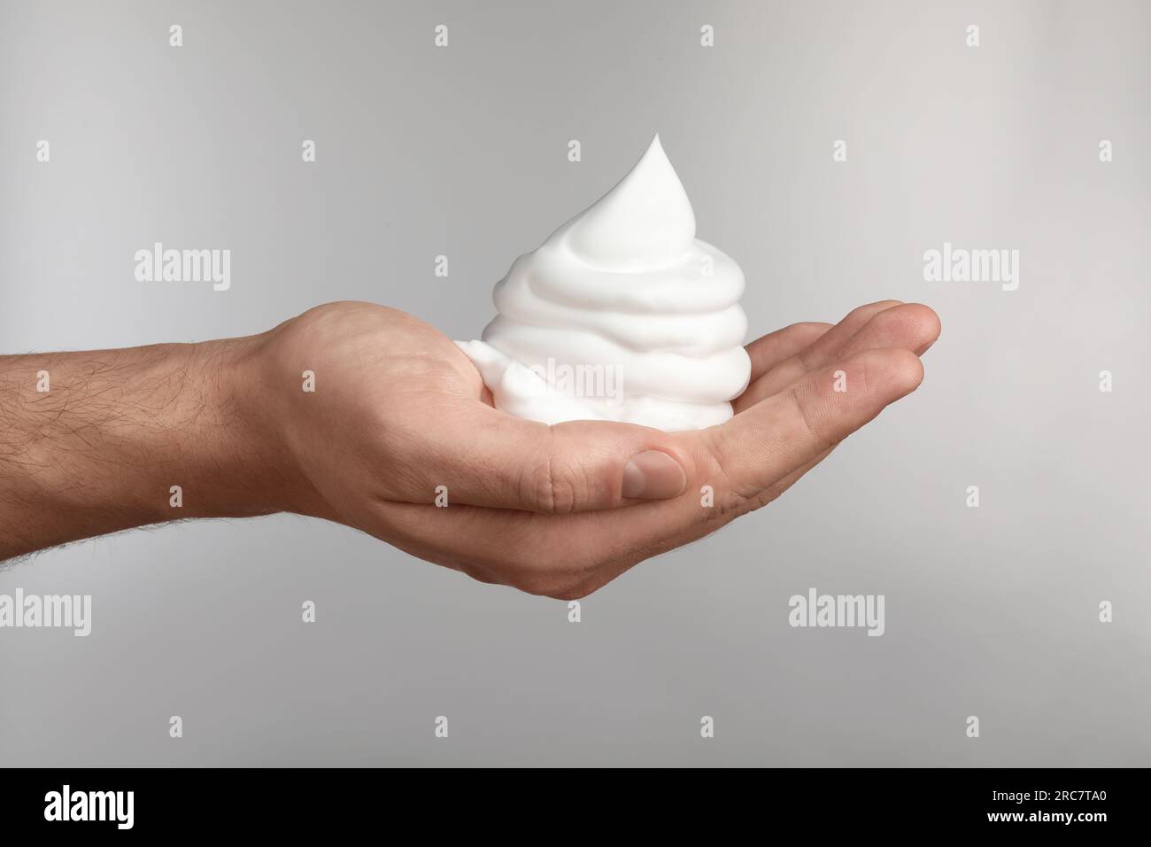 Man holding shaving foam on light grey background, closeup Stock Photo ...