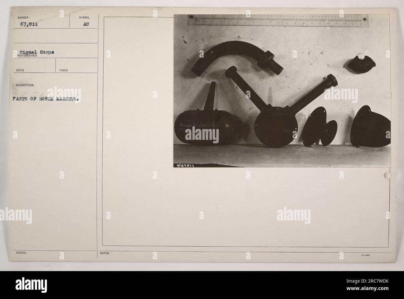 Caption: Photograph of a Bosch magneto, part number SUMBER 67,811 from ...