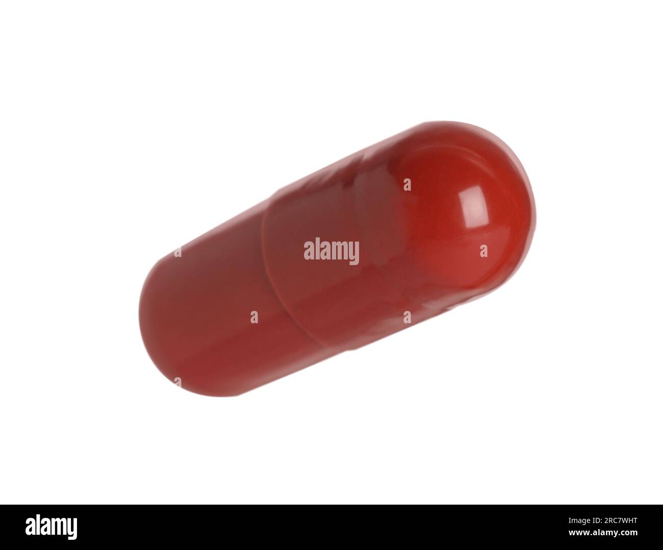 One red pill on white background. Medicinal treatment Stock Photo - Alamy