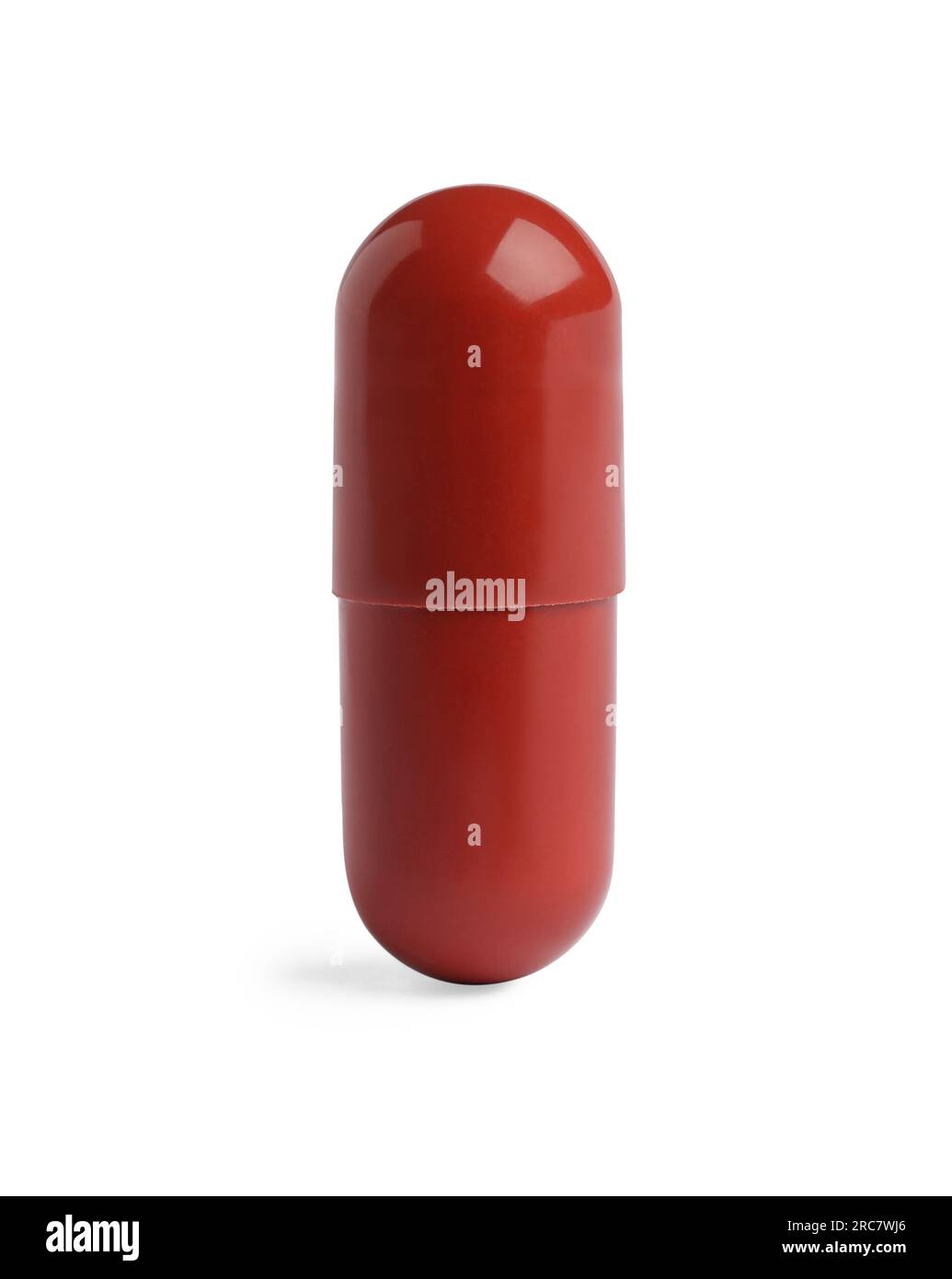 One red pill on white background. Medicinal treatment Stock Photo - Alamy