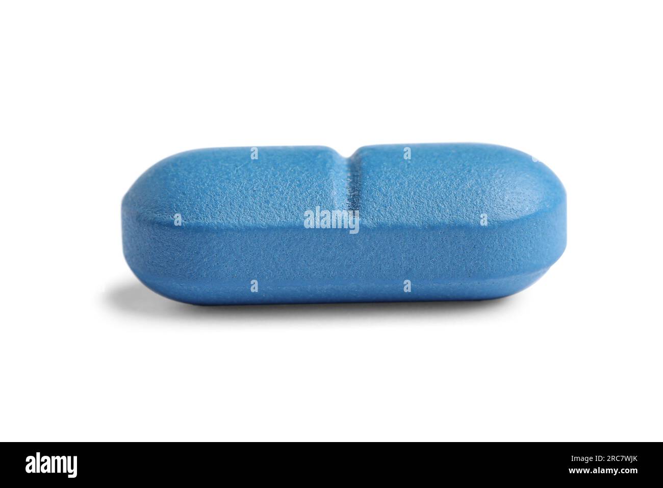 One blue pill on white background. Medicinal treatment Stock Photo - Alamy
