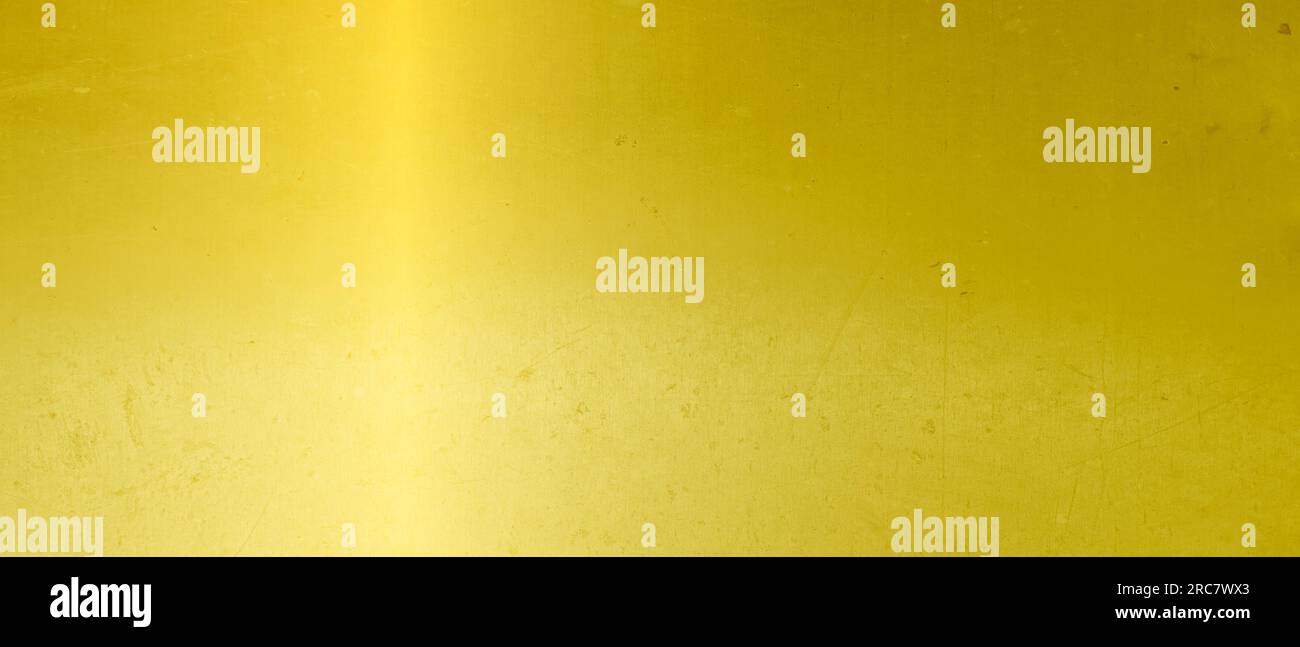 Shiny gold surface as background, closeup view Stock Photo - Alamy