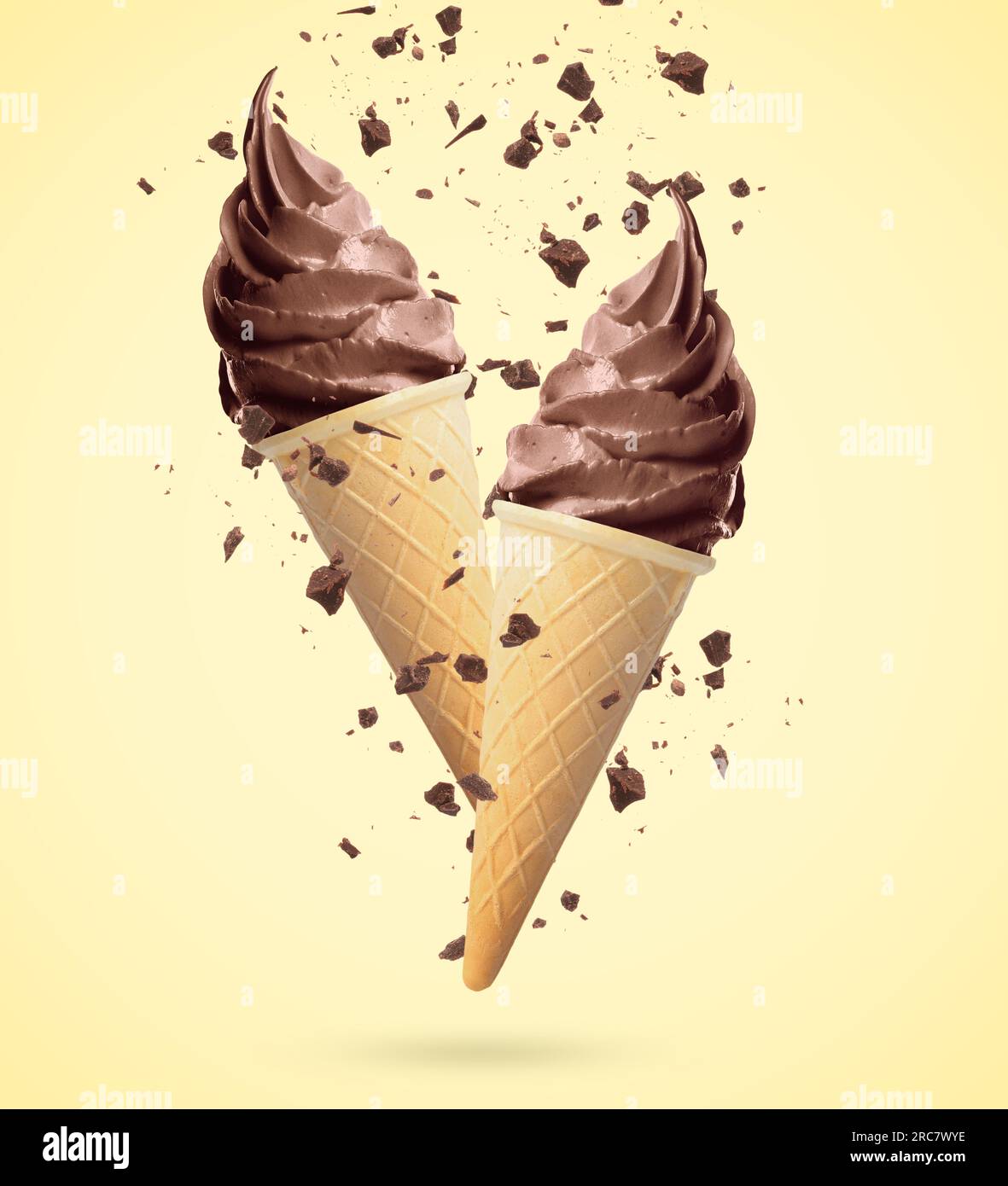 Delicious chocolate ice cream in crispy cones falling on beige ...
