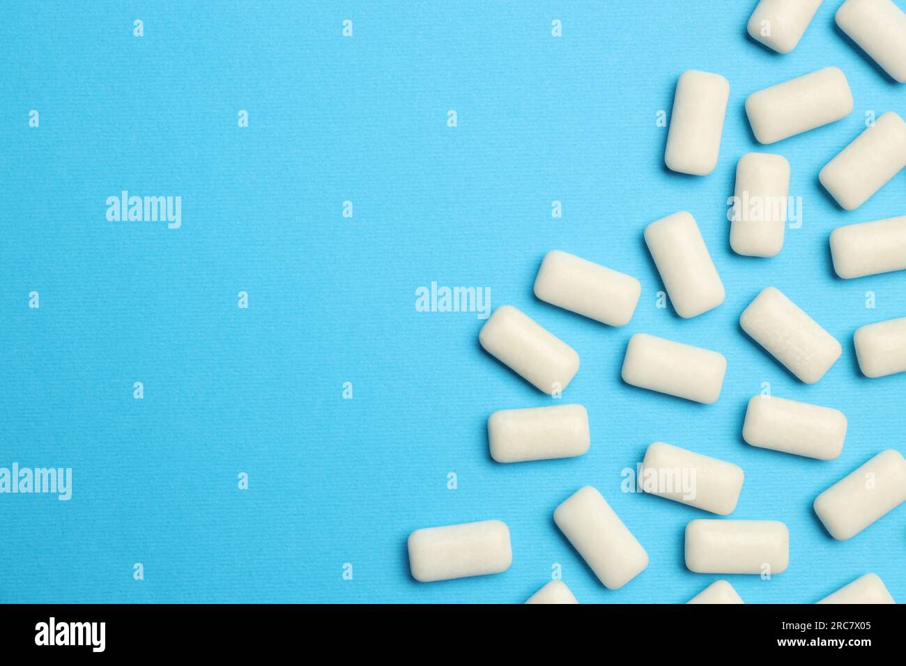 White bubble gums on blue background, flat lay. Space for text Stock ...