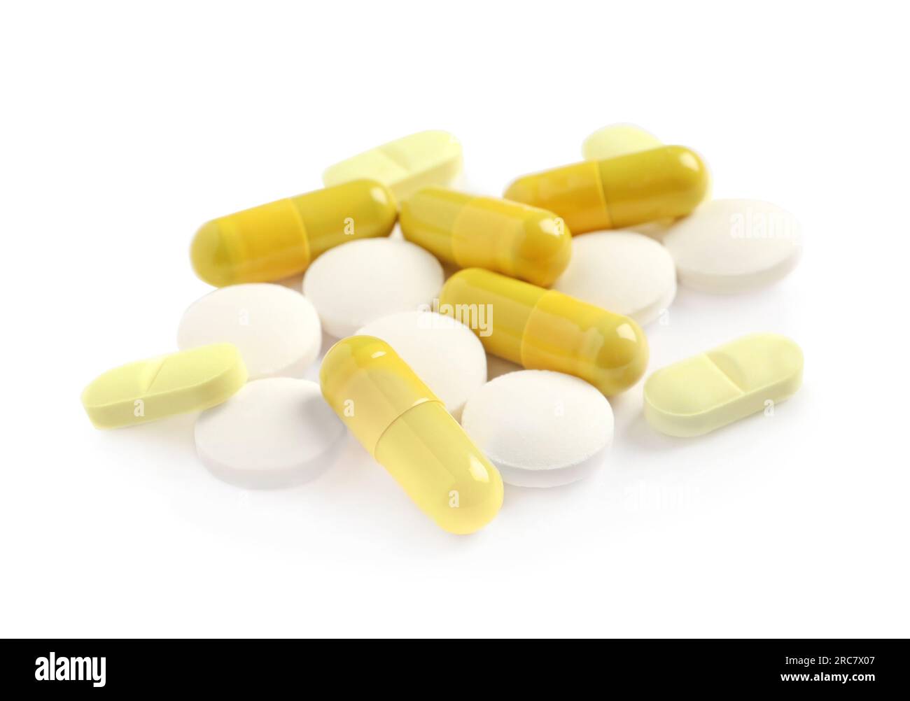 Many different pills isolated on white. Medicinal treatment Stock Photo ...