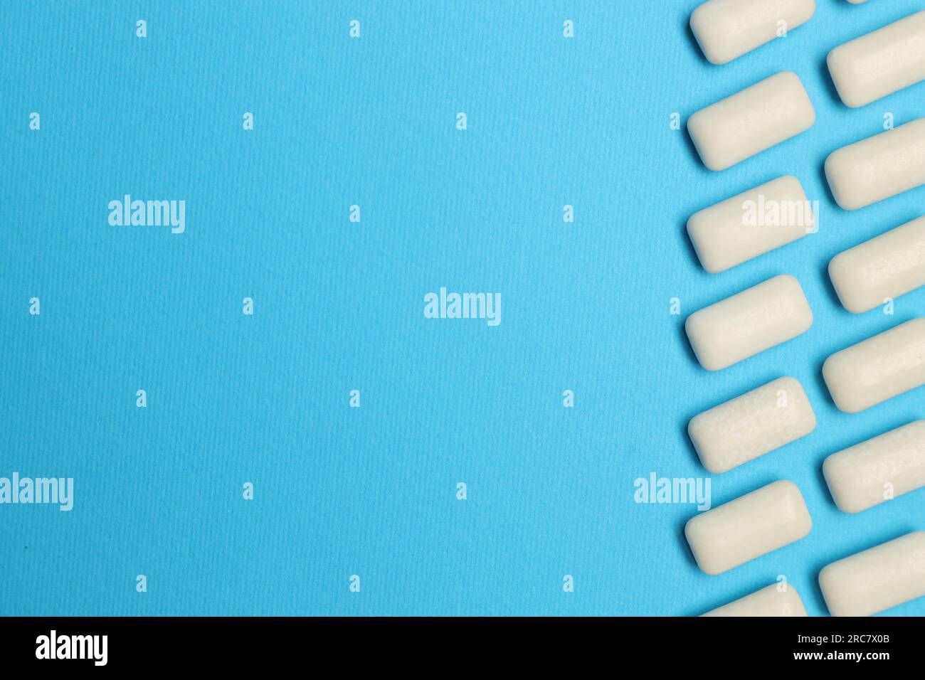 White bubble gums on blue background, flat lay. Space for text Stock ...