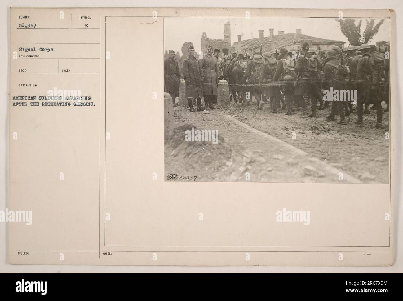 American soldiers advancing after the retreating Germans. This ...