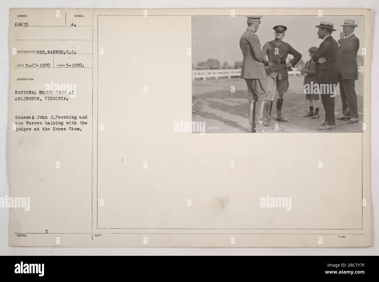 Caption: General John J. Pershing and his son Warren engaging in ...