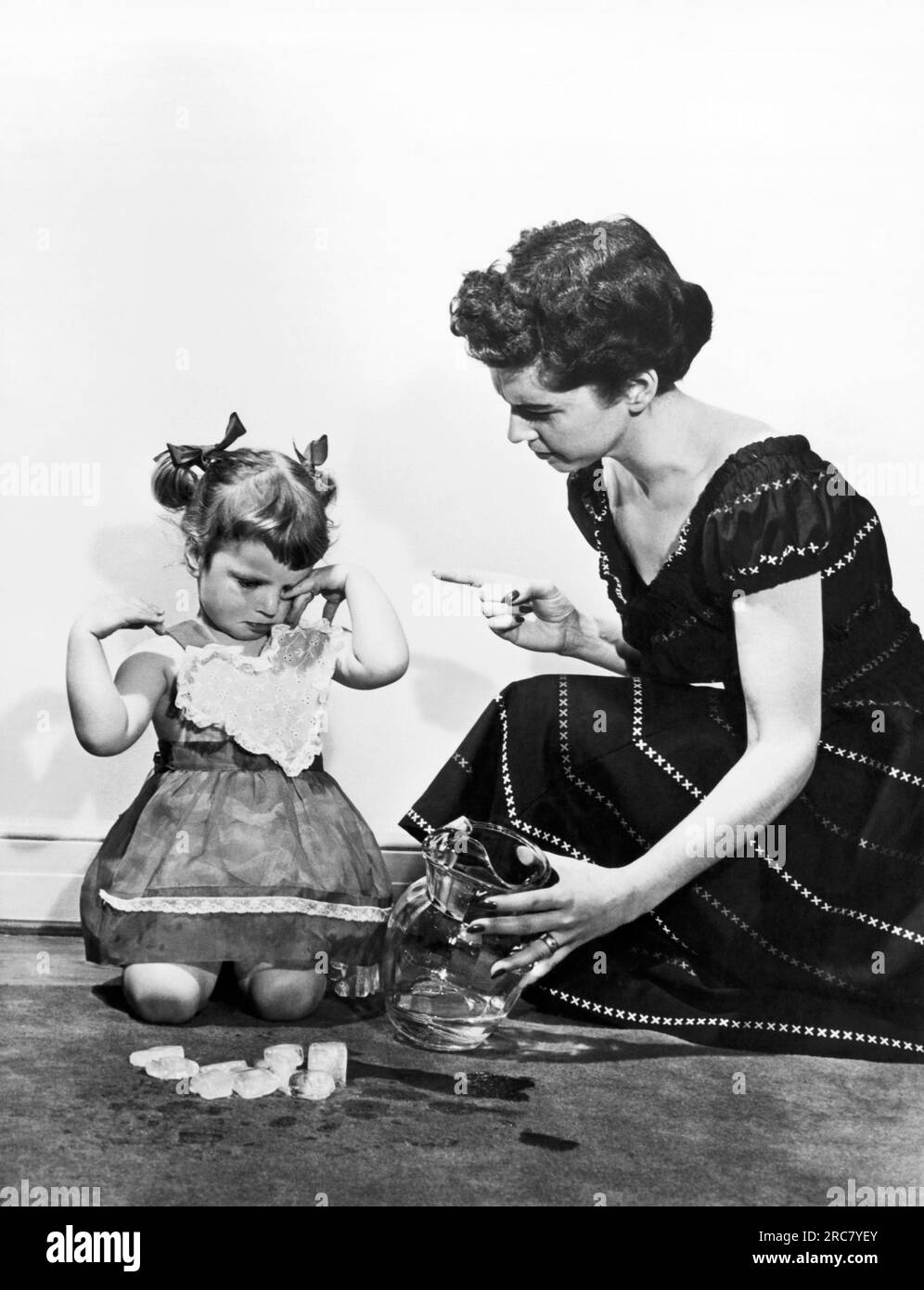 United States 1952 A Mother Admonishes Her Young Daughter For Spilling A Pitcher Of Ice Water