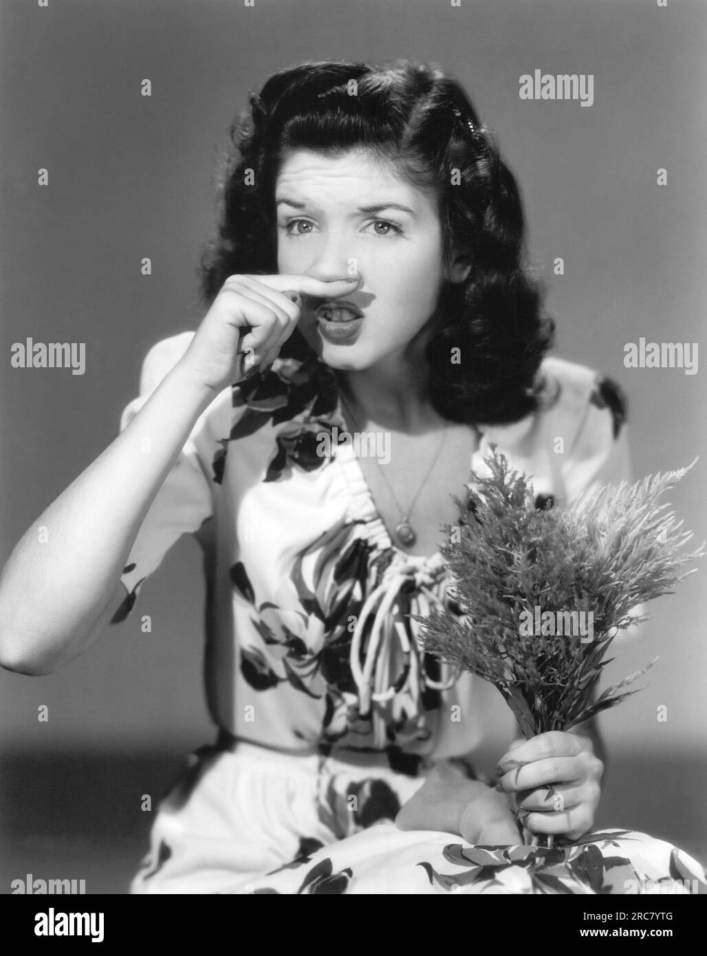 Hollywood, California: 1944 Actress Peggy Ryan tried to defuse a sneeze ...