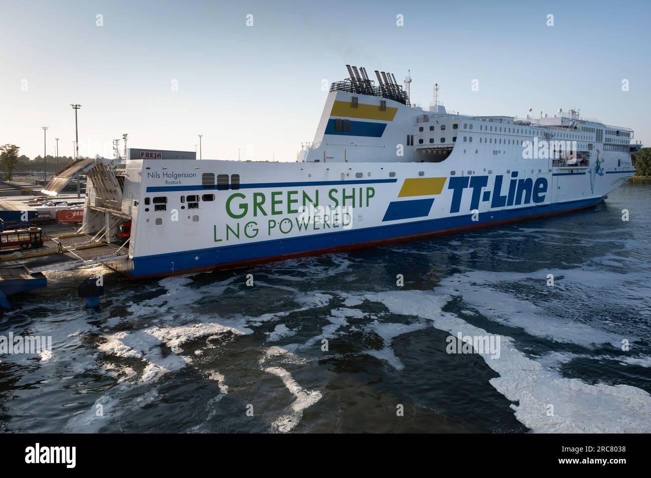Trucks leave the Green ship TT-Line ferry NILS HOLGERSSON, LNG Powered, in the harbor of ...