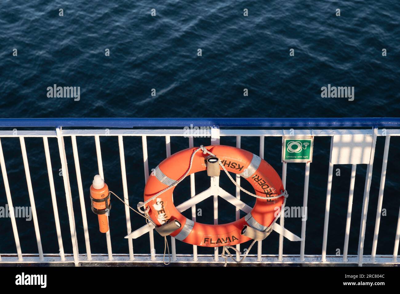 Lifebuoy with self-igniting light mounted on the railing of the Stena ...