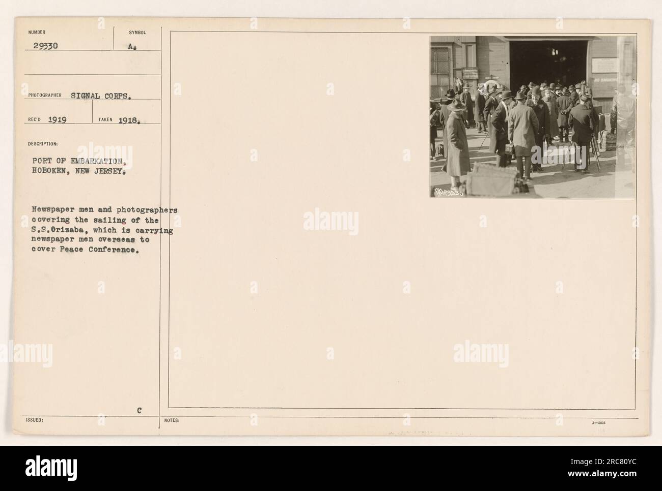 Newspaper men and photographers gather at the port of embarkation in ...