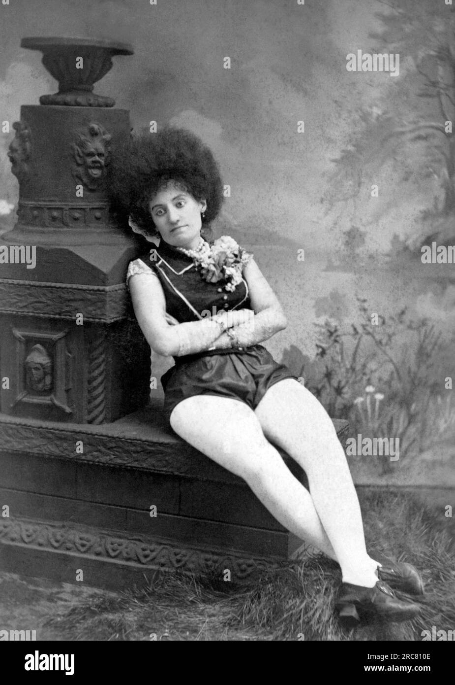 Chicago, Illinois: c. 1880 A woman vaudeville performer sits morosely ...