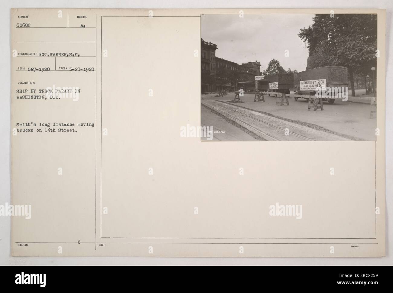 A truck parade featuring Smith's long distance moving trucks on 14th ...