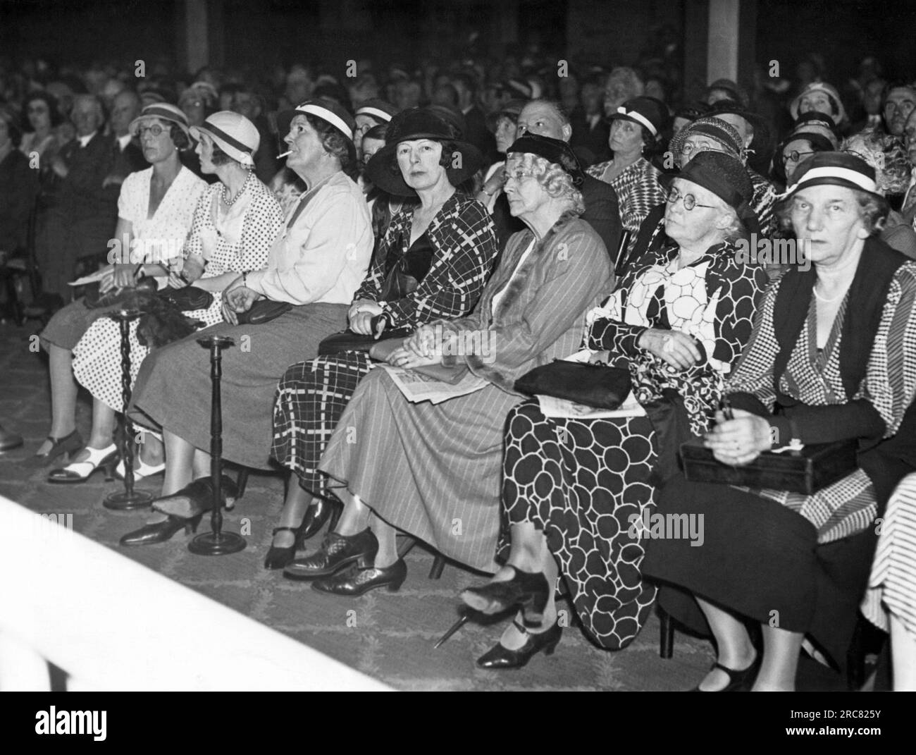London, England: c. 1936 Women spectators at a fashion show Stock Photo ...
