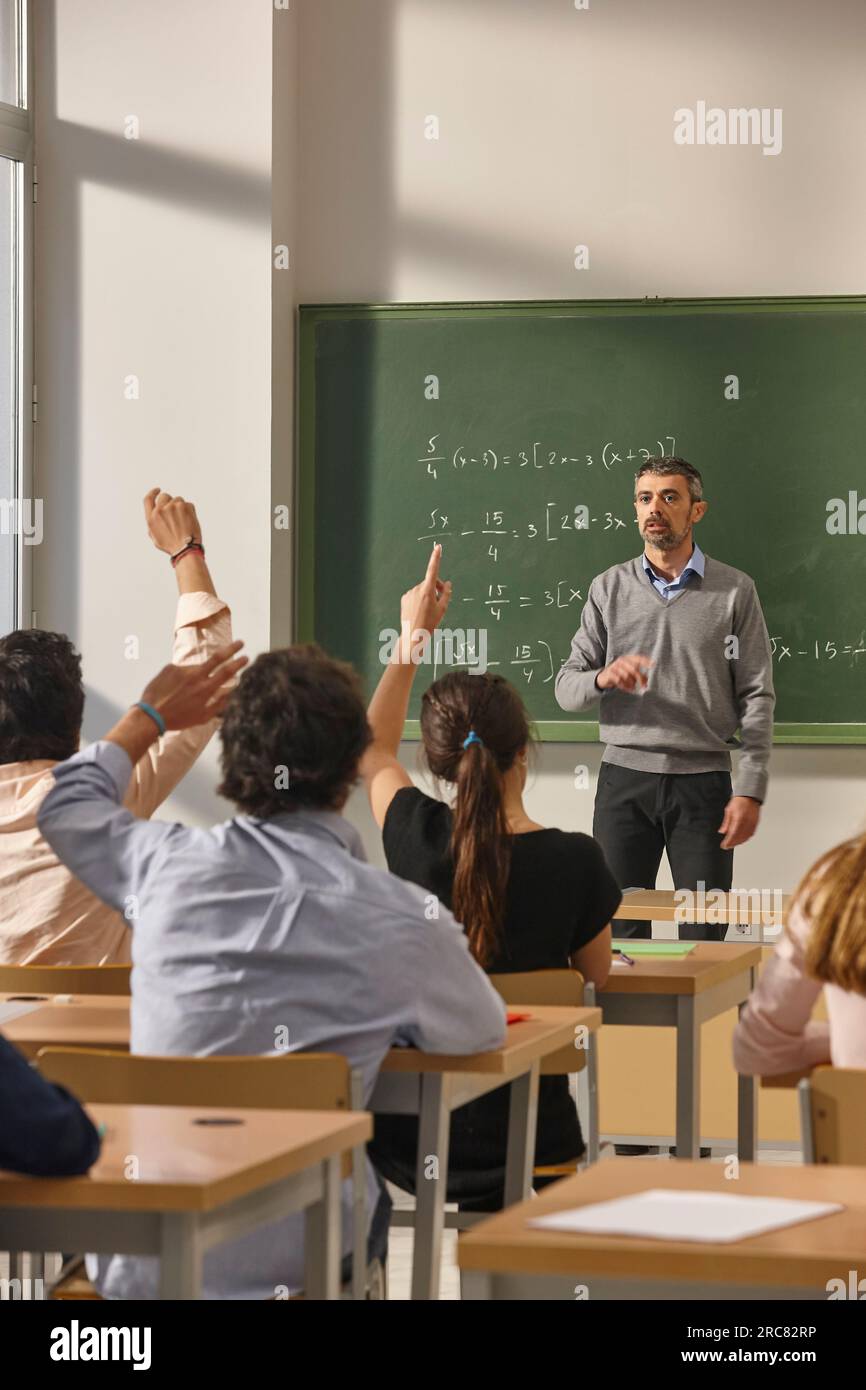 Math teacher giving lessons. Classroom with students. School education ...