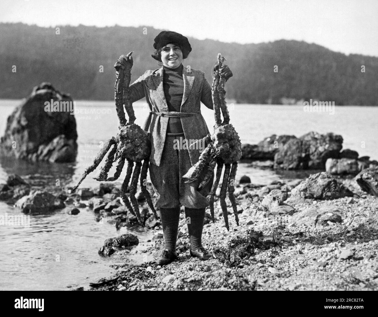 Cook's Inlet, Alaska: May 31, 1926. Mrs. Frank Kleinschmidt holds up ...