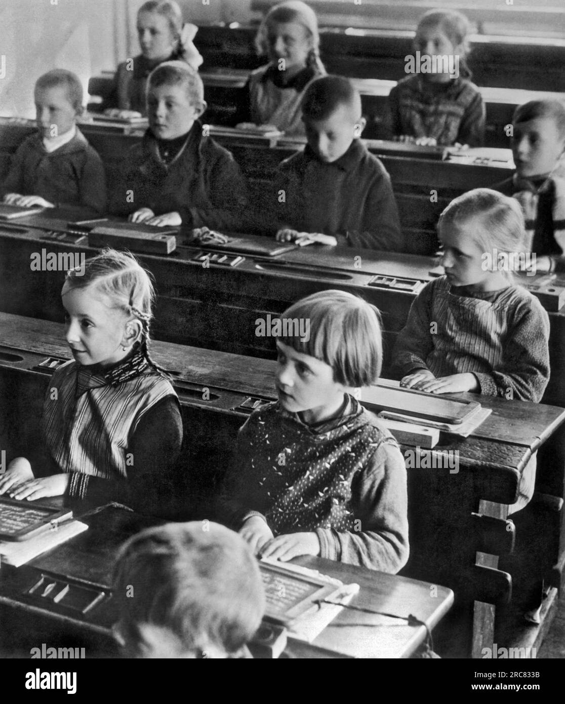 Berlin, Germany: c. 1932 Children learning their ABC's in a classroom ...