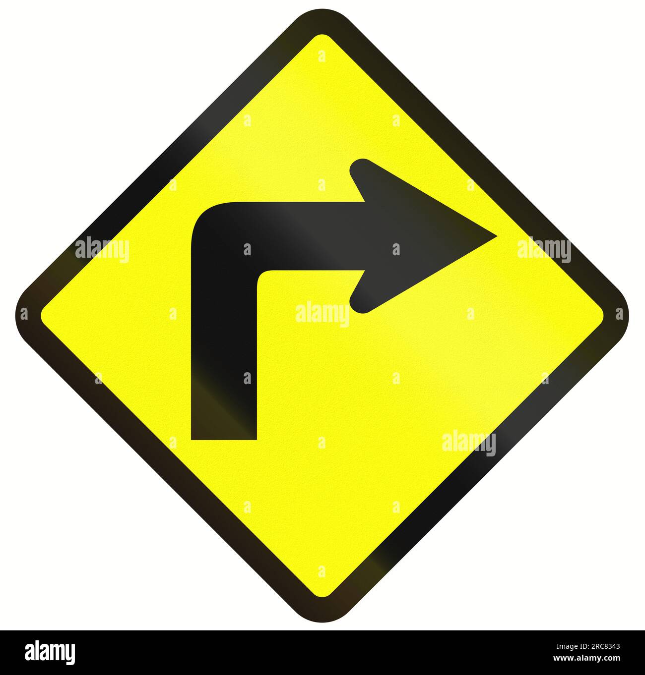 Indonesian road warning sign: Right curve ahead Stock Photo - Alamy