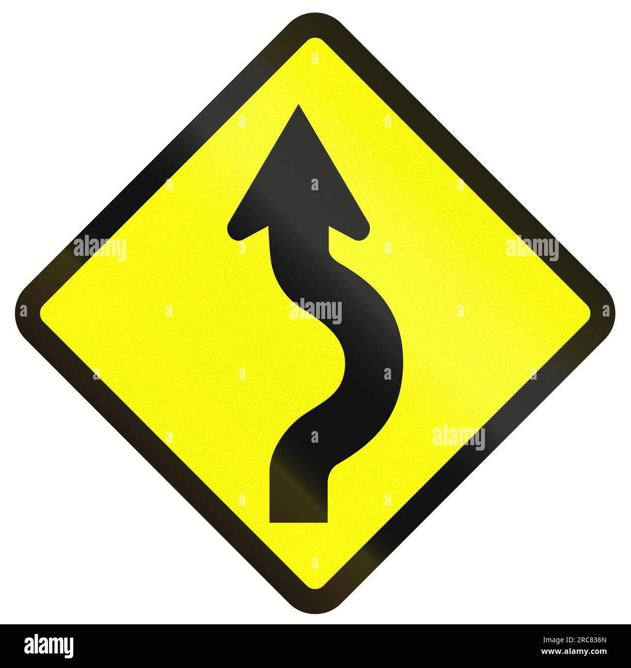 Indonesian traffic warning sign: Single two reverse curve Stock Photo ...
