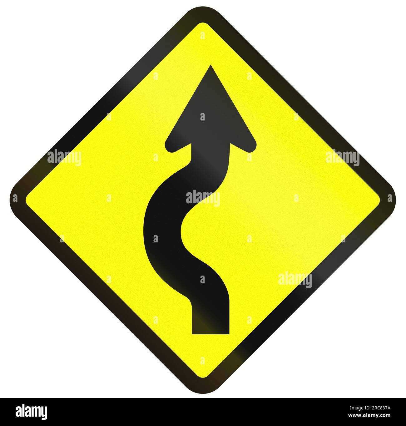 Indonesian traffic warning sign: Single two reverse curve Stock Photo - Alamy