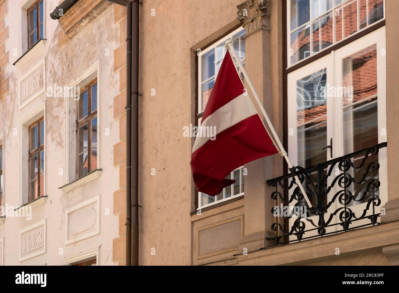 The national Latvian flag with two wide red horizontal bands, separated ...