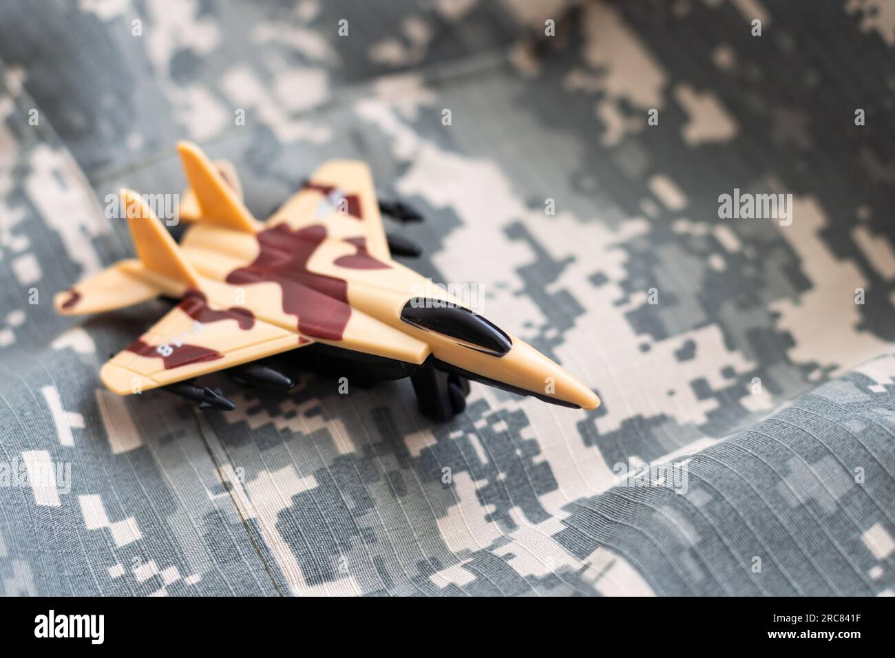 children's toy plastic military plane in green color Stock Photo - Alamy
