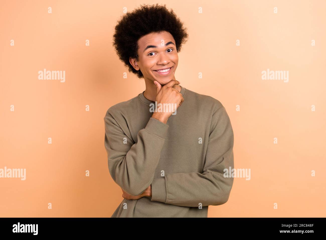 Portrait of minded positive person toothy smile arm touch chin ...