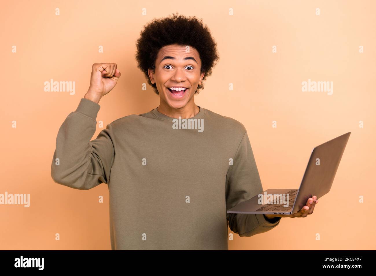 Photo of youngster excited overjoyed successful junior it programmer ...