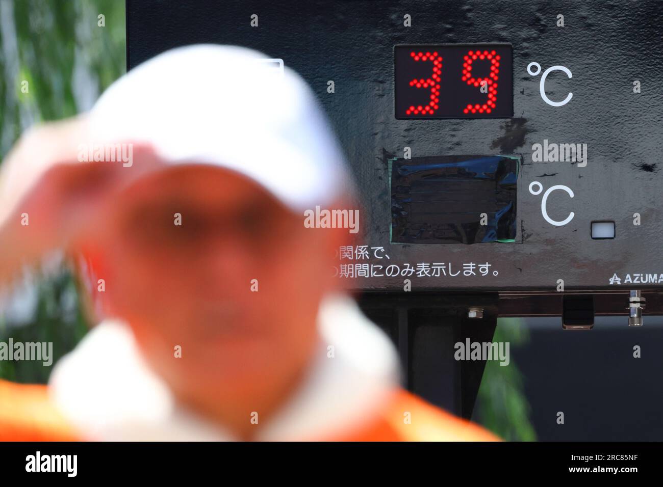 Tokyo, Japan. 12th July, 2023. A thermometer on the street displays a ...