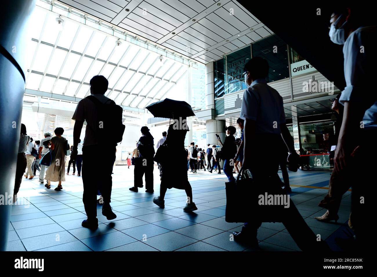 Tokyo, Japan. 12th July, 2023. Pedestrians walk in the heat at a ...