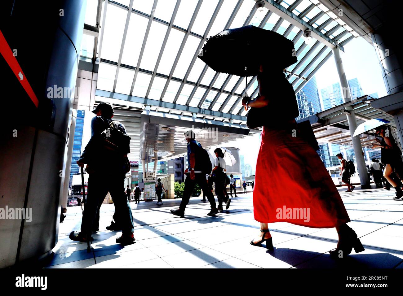 Tokyo, Japan. 12th July, 2023. Pedestrians walk in the heat at a ...