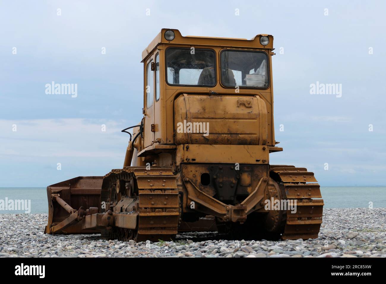 bulldozer on the beach in Batumi Stock Photo - Alamy