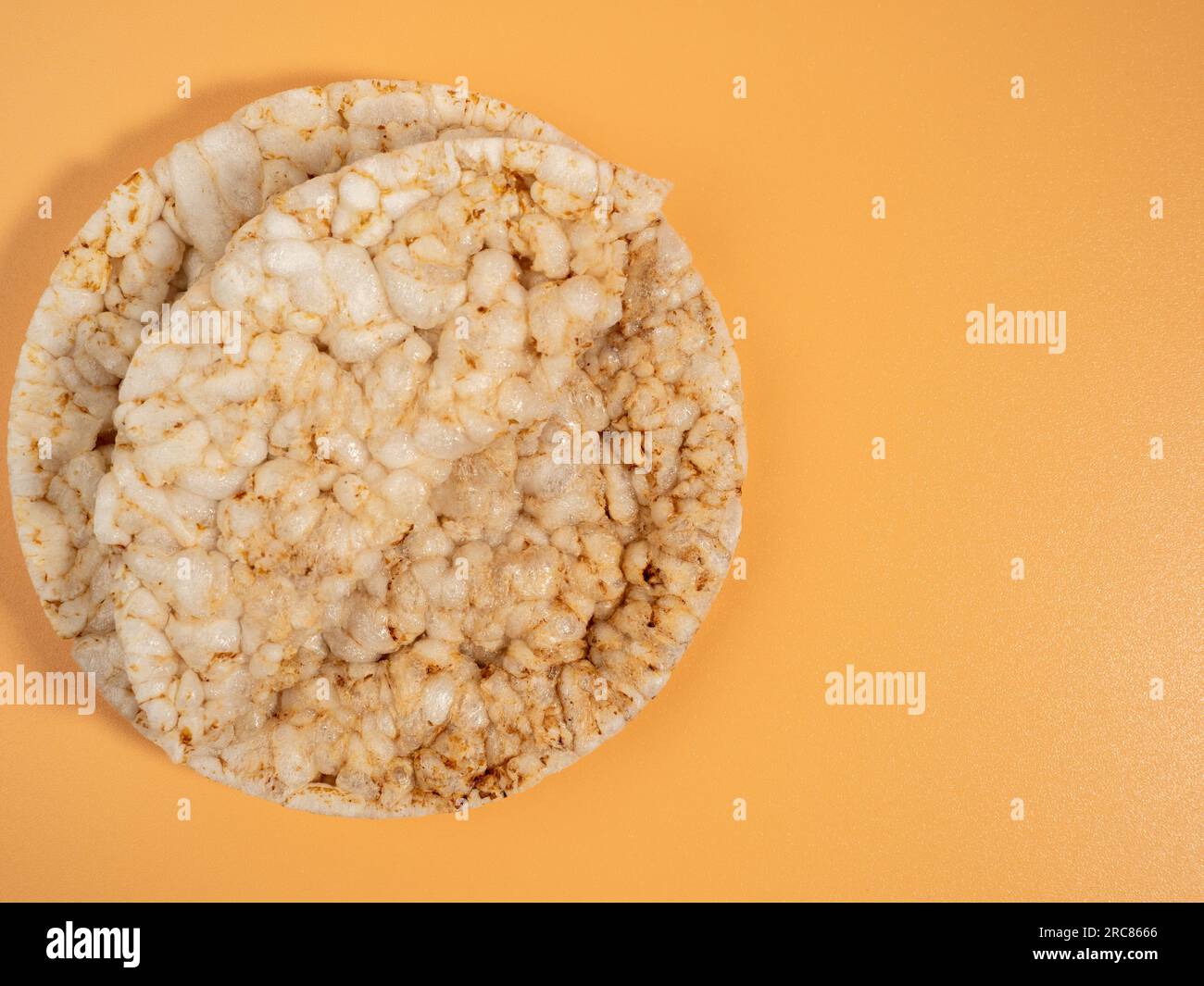 Rice waffles on a beige background with copy space. Rice wafers close ...