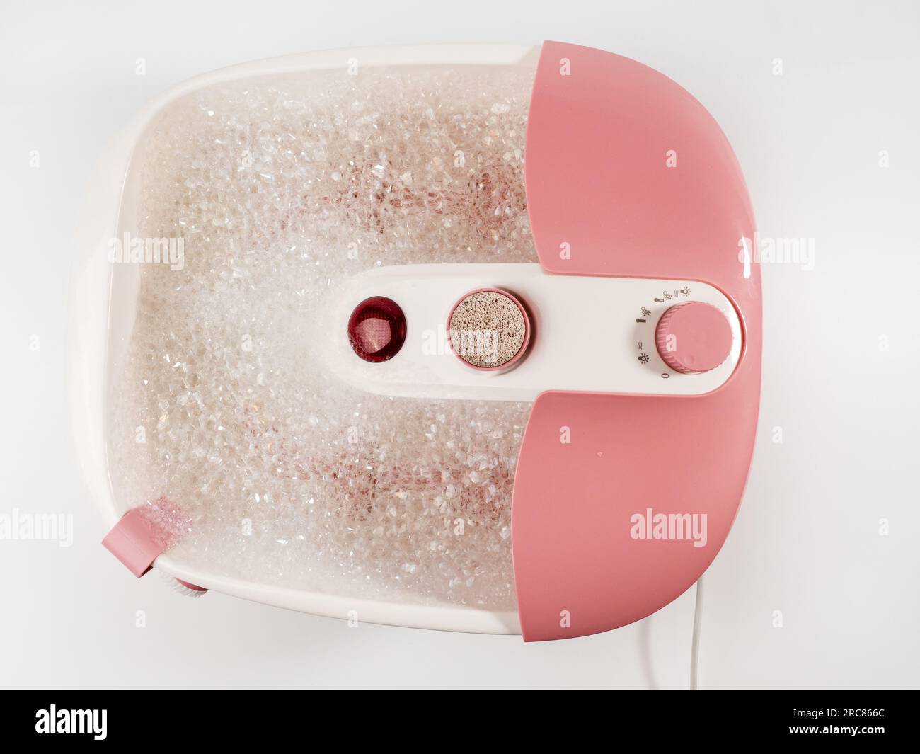 Vibrating foot massager on a white background. Foot bath close-up Stock ...