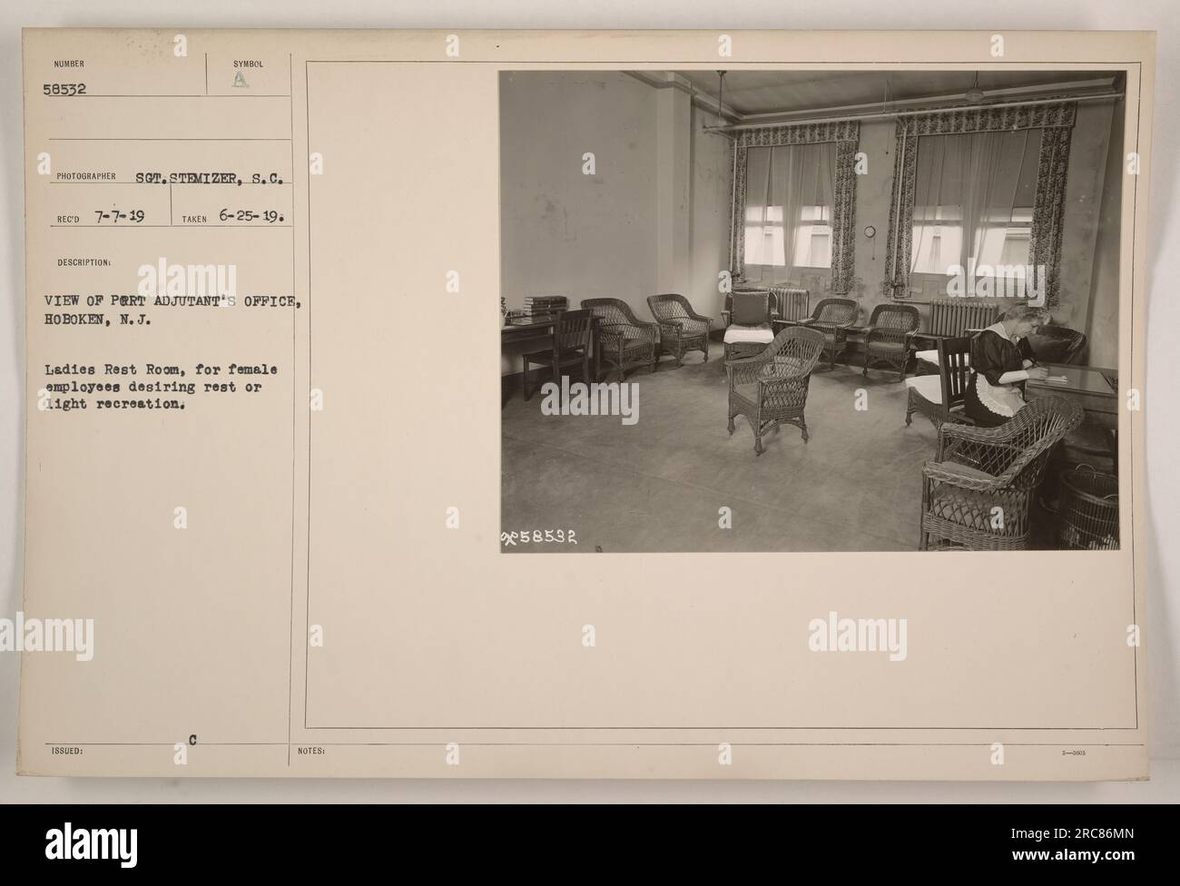 FEMALE EMPLOYEES AT THE PORT ADJUTANT'S OFFICE in Hoboken, N.J., take a ...