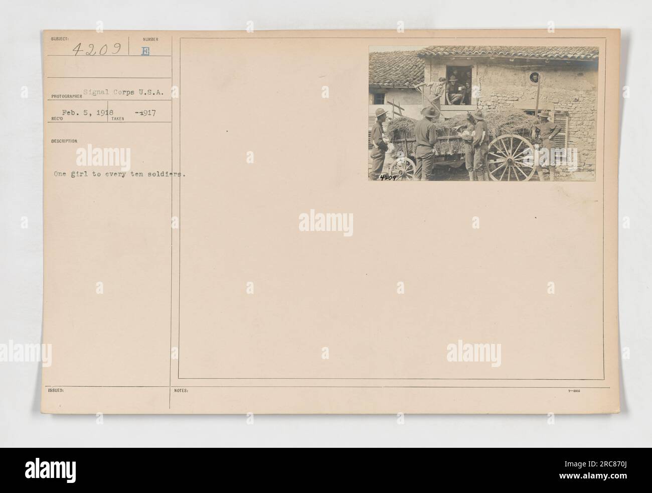 This photograph shows a group of ten soldiers standing with one girl ...