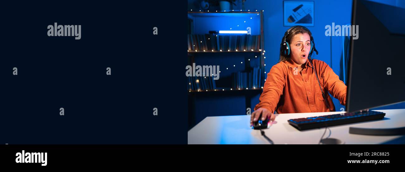 Young gamer girl playing video games scared in shock with a surprise ...