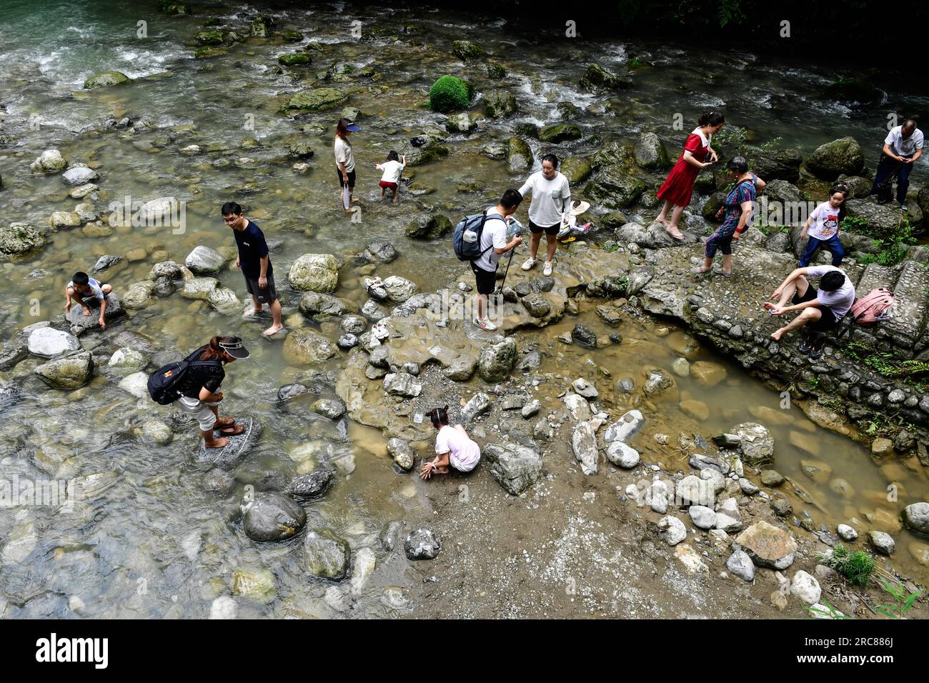 People escape the summer heat at the Black Valley scenic area in ...