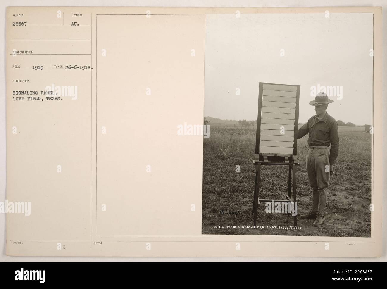 A soldier uses a signaling panel at Love Field in Texas during World ...