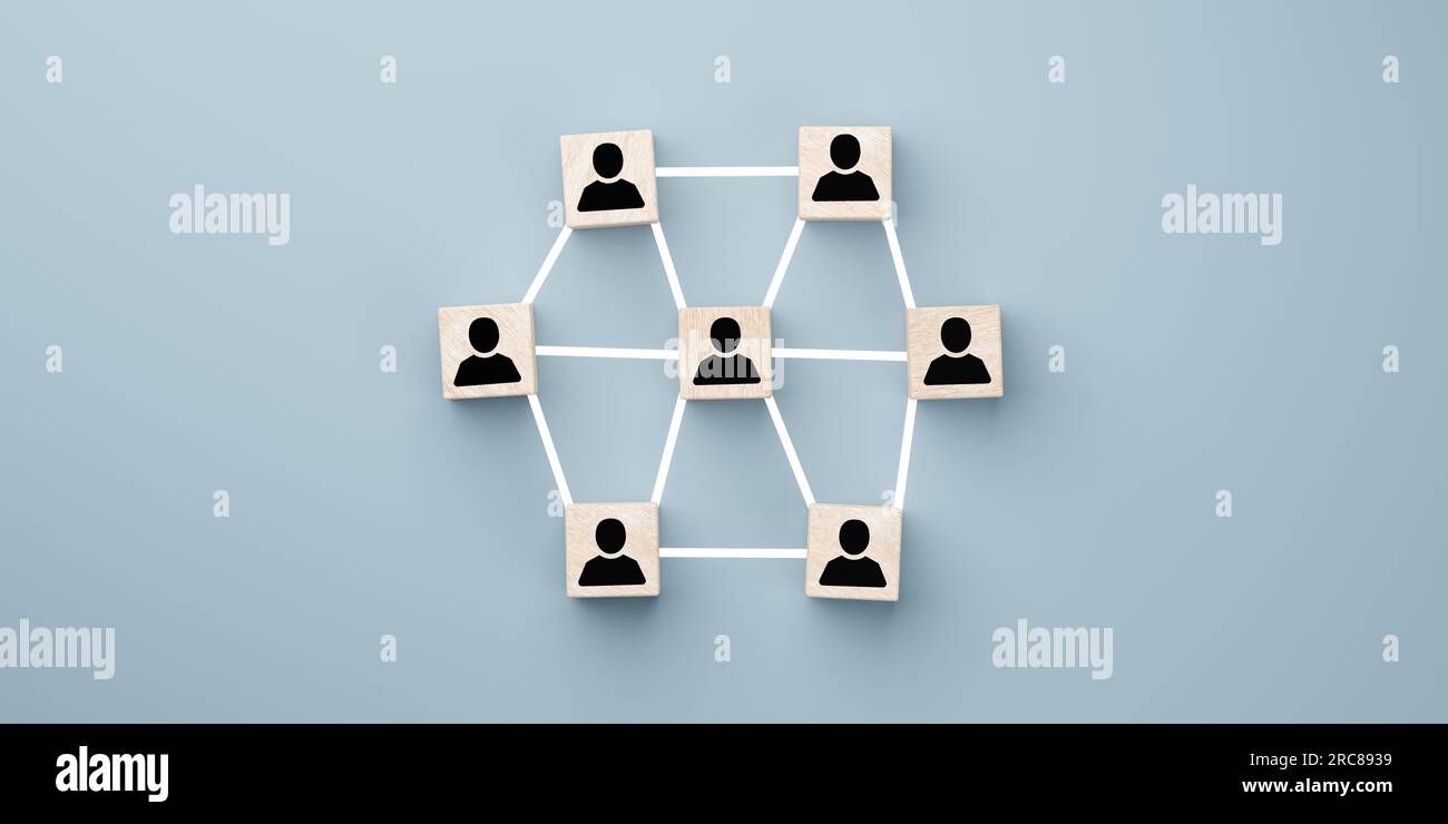 Company hierarchical organizational chart of wooden cubes on blue ...