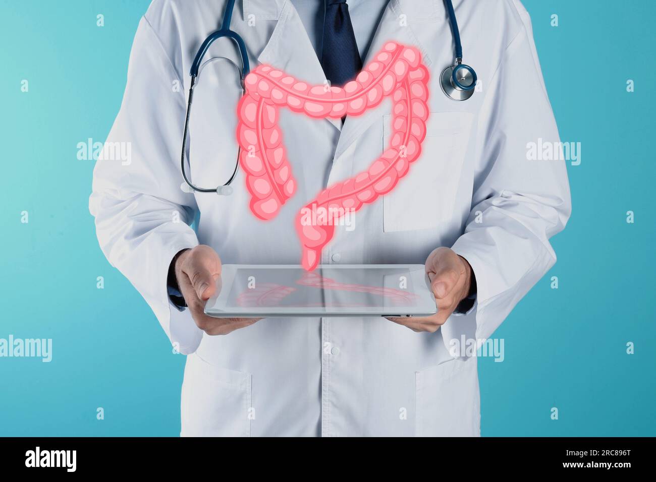 Gastroenterologist holding tablet computer on light blue background ...